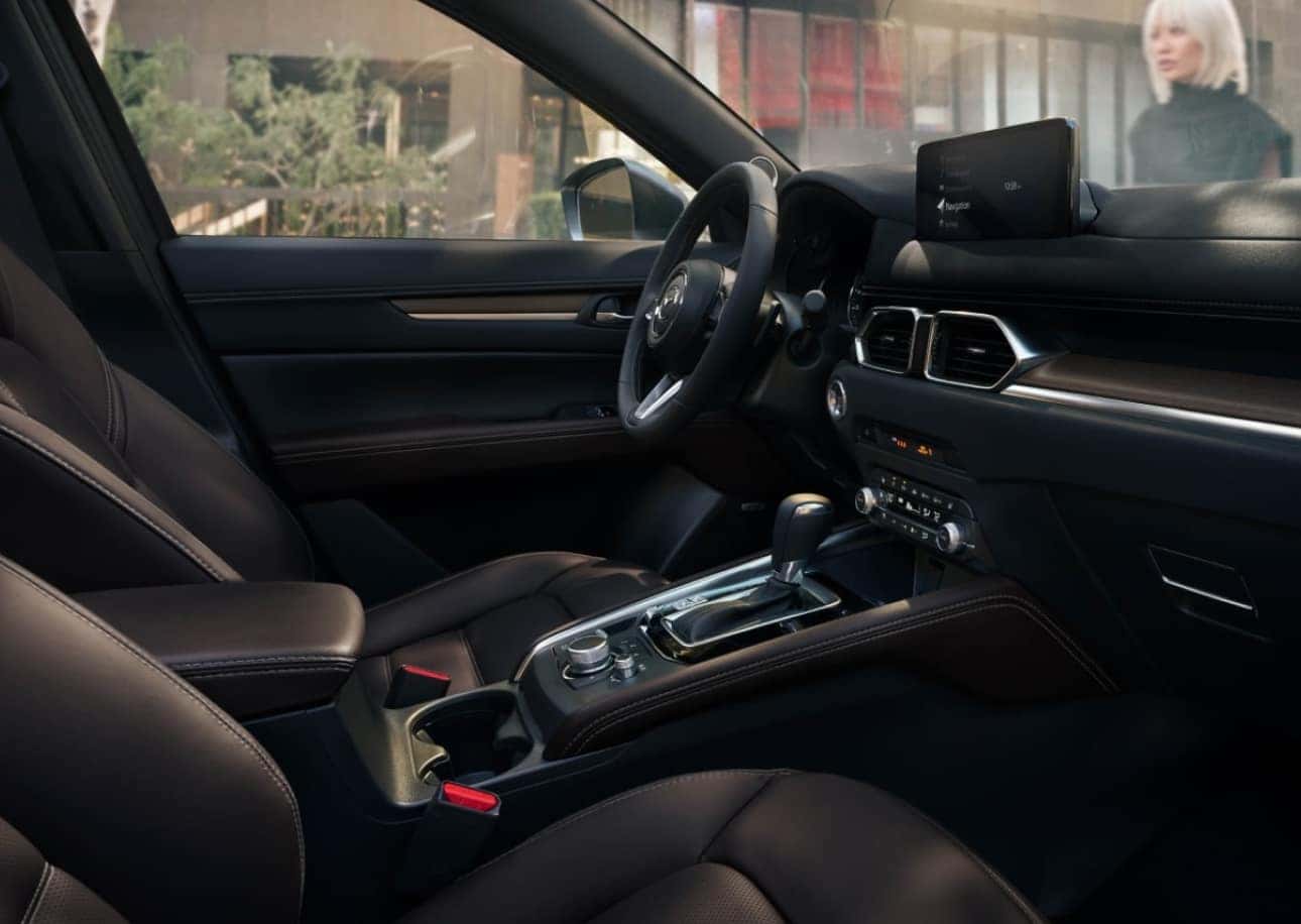Where Is The Gas Tank Button On A Mazda?